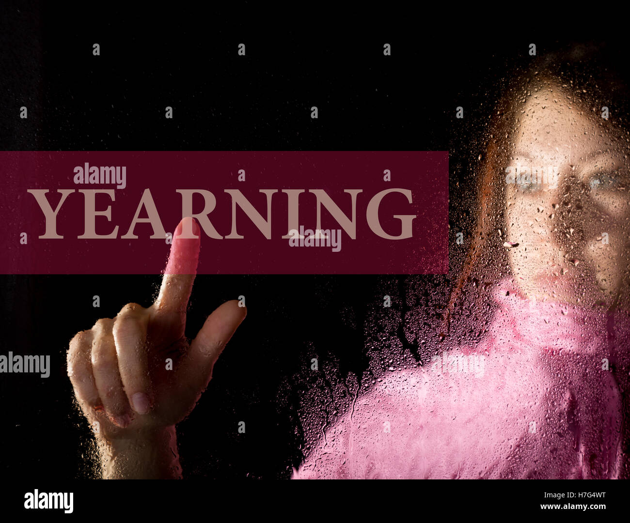 yearning written on virtual screen. young woman melancholy and sad at ...