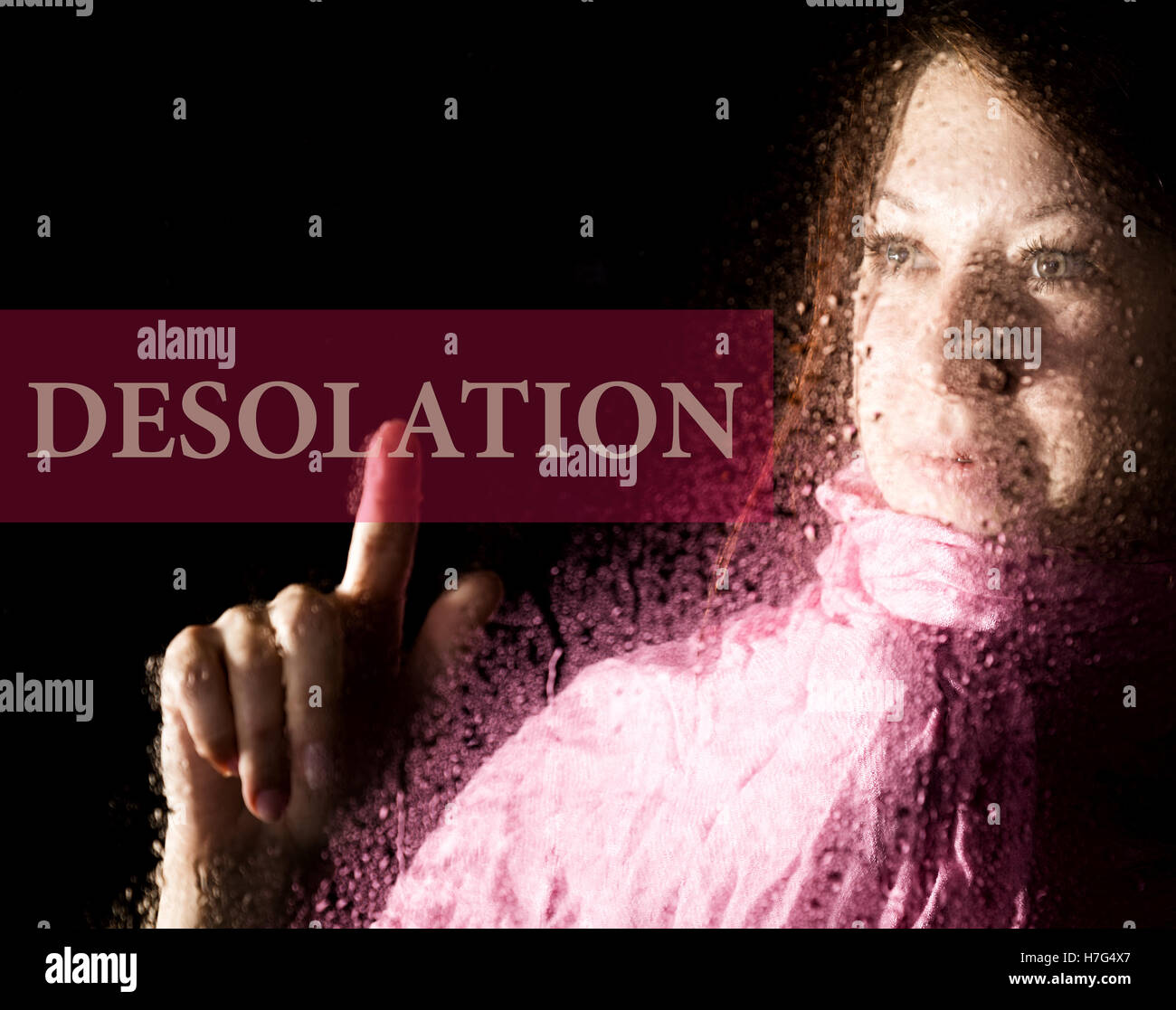 desolation written on virtual screen. young woman melancholy and sad at ...