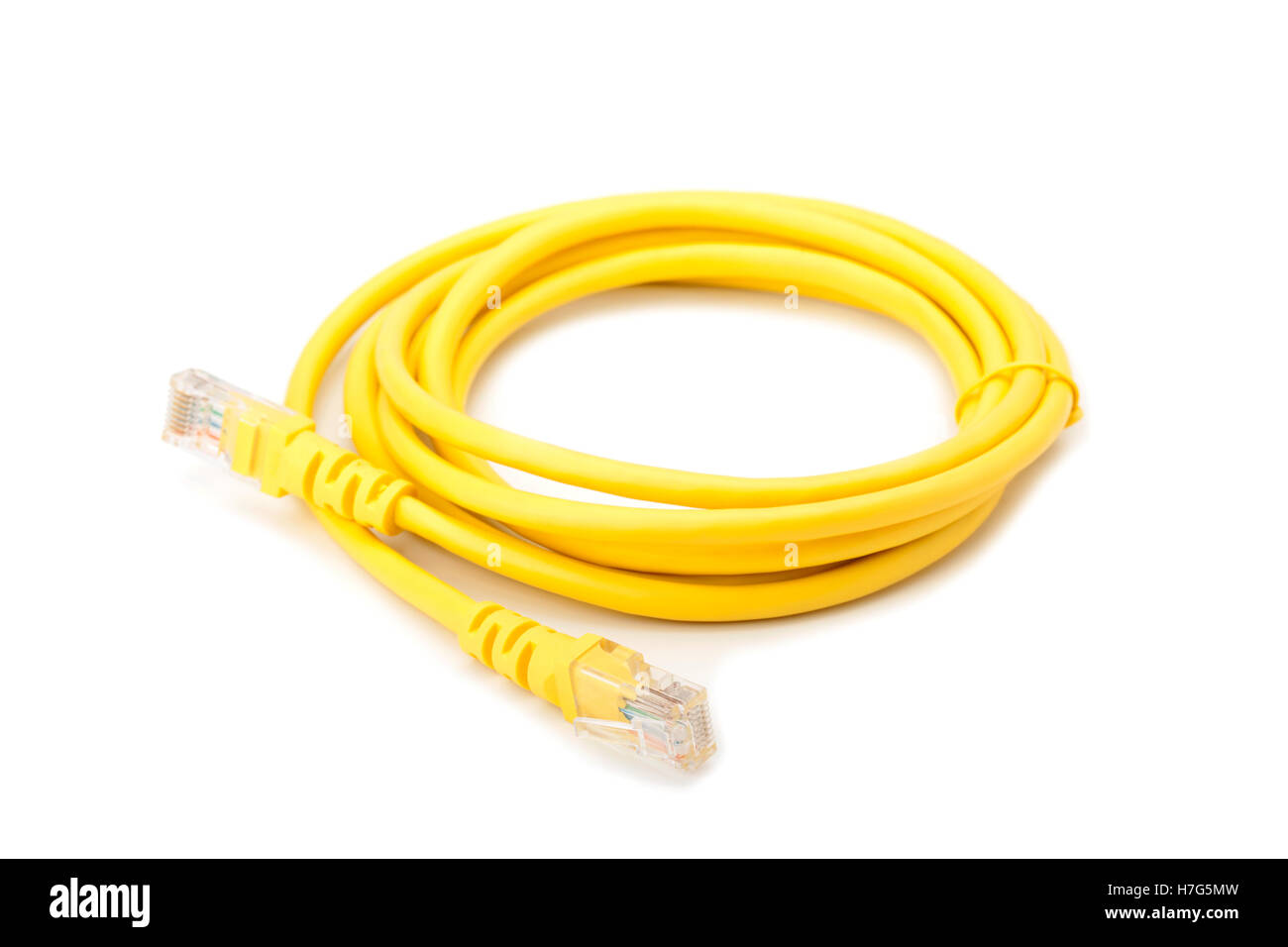 Yellow LAN cable isolated on white background Stock Photo - Alamy