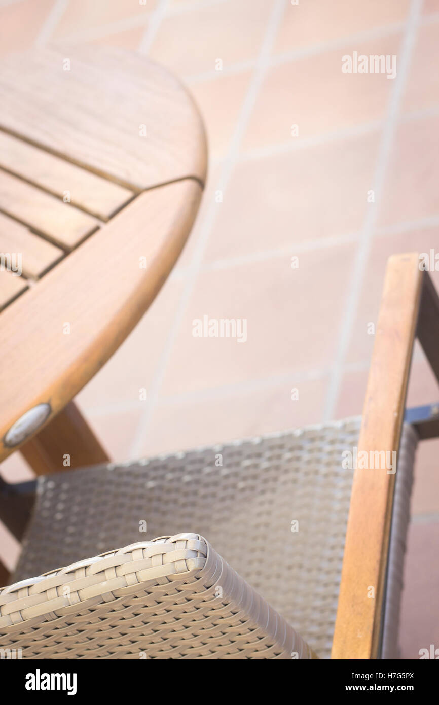 Outdoor wooden summer terrace furniture table and chairs set in hotel ...