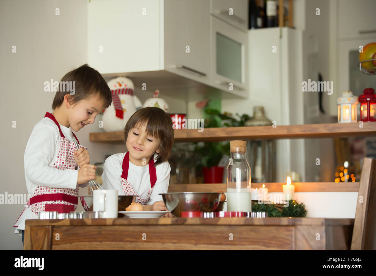Two sweet children, boy brothers, preparing gingerbread cookies for ...