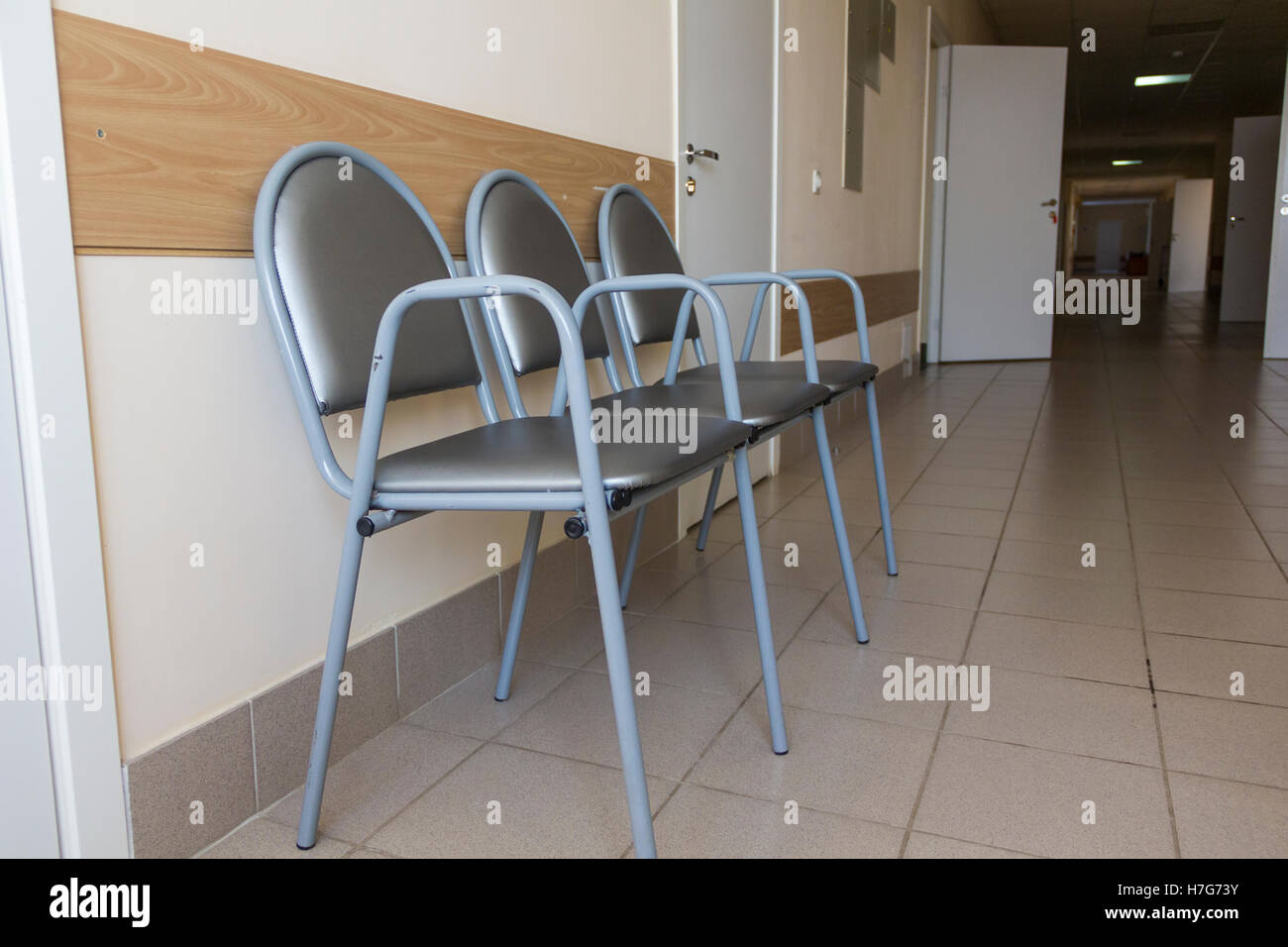 Photo of row chairs in empty corridor Stock Photo - Alamy