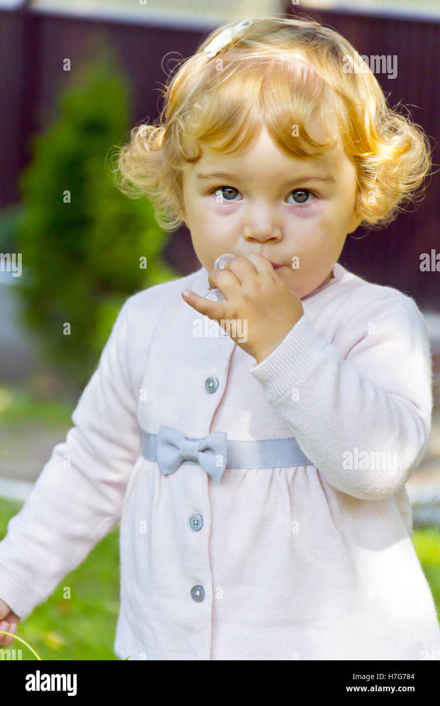 Curly blond girl hi-res stock photography and images - Alamy