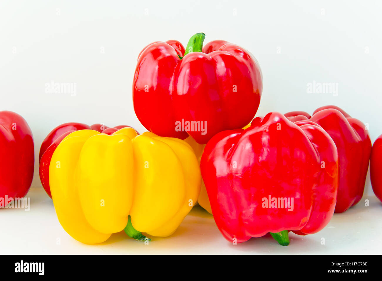 Photo of fresh red and yellow raw pepper on white background Stock ...