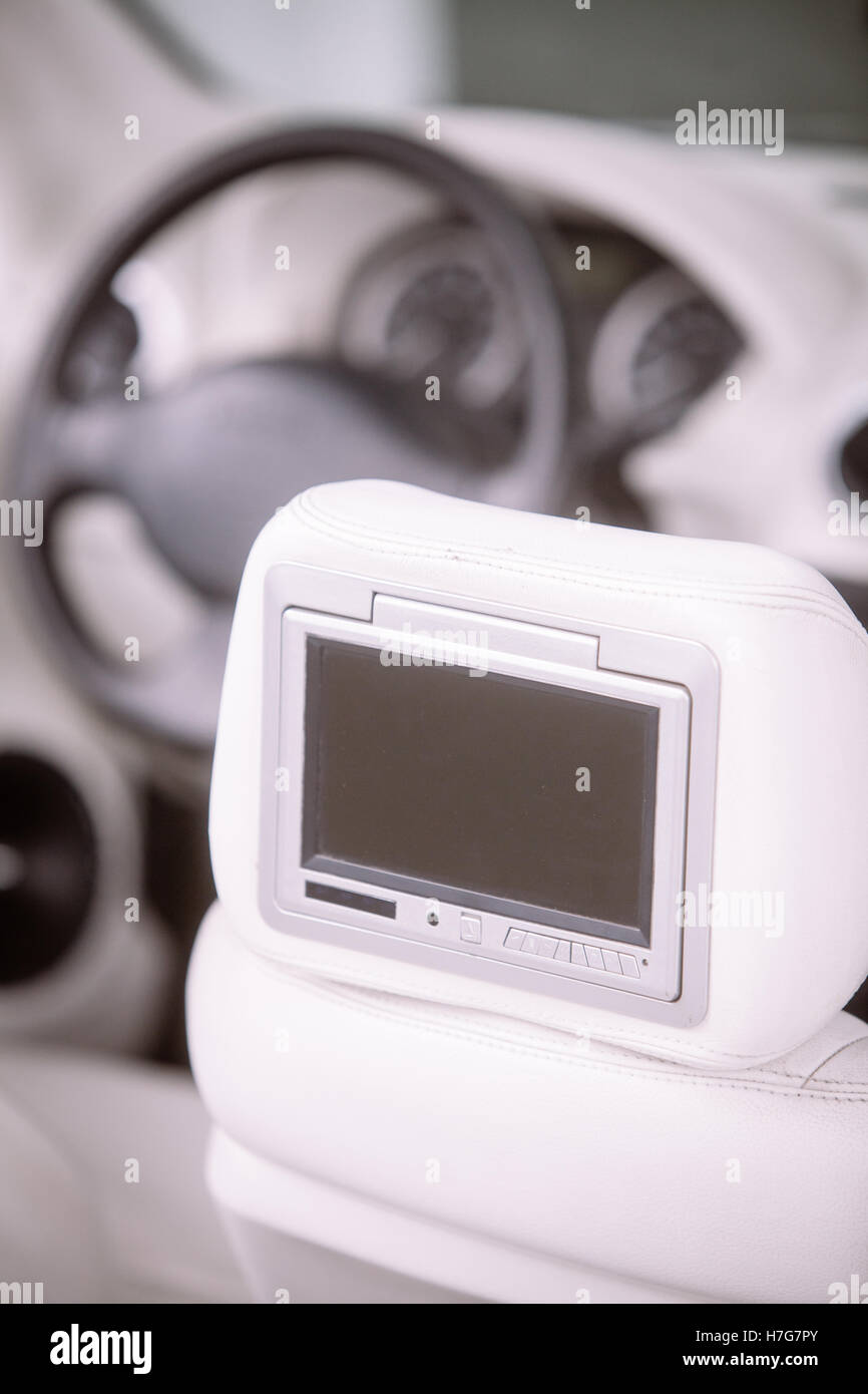 Close up shot of a small screen dvd player inside a car Stock Photo - Alamy