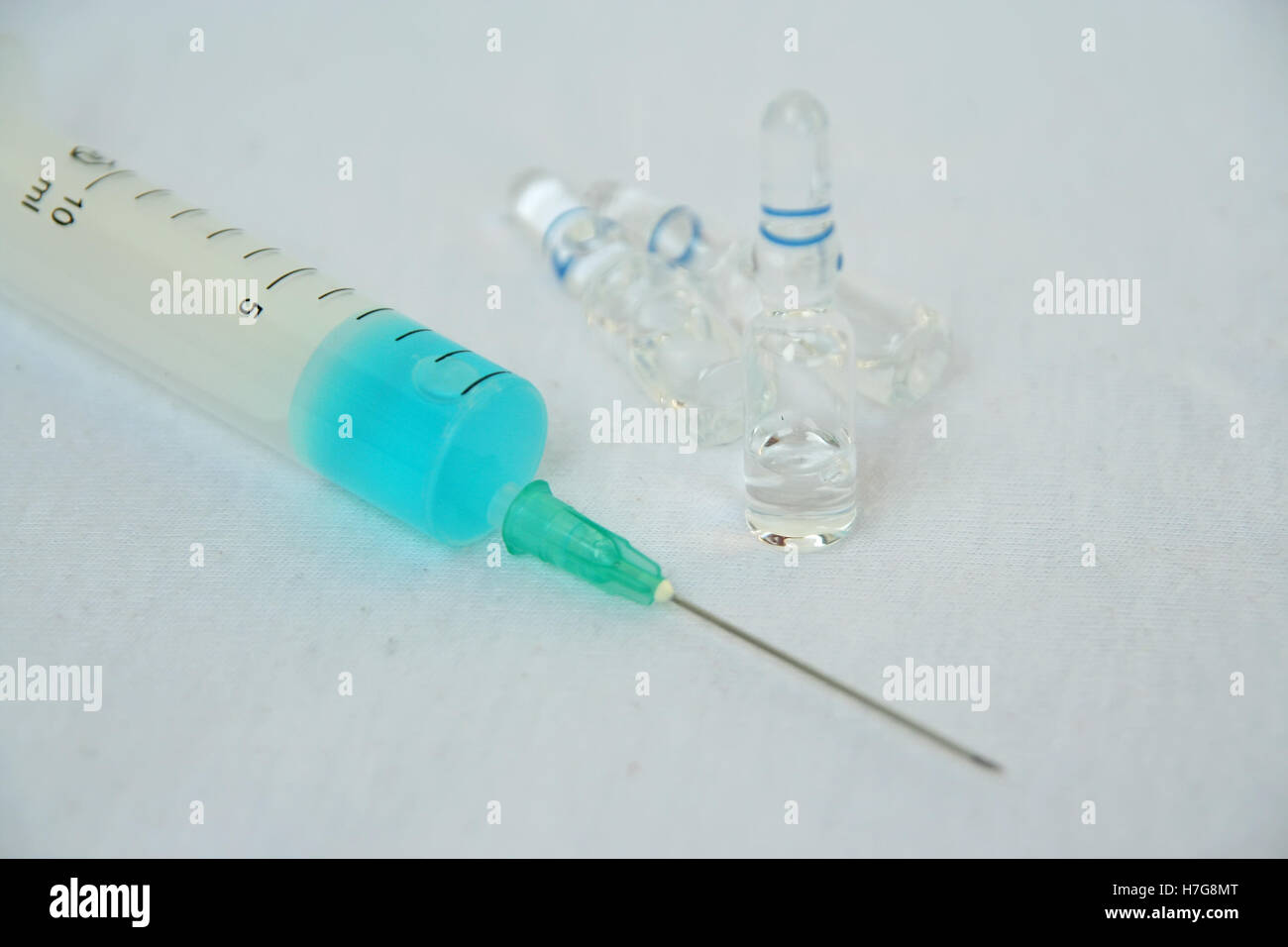 Medical tools. Medical syringe. Syringe and a cure Stock Photo - Alamy