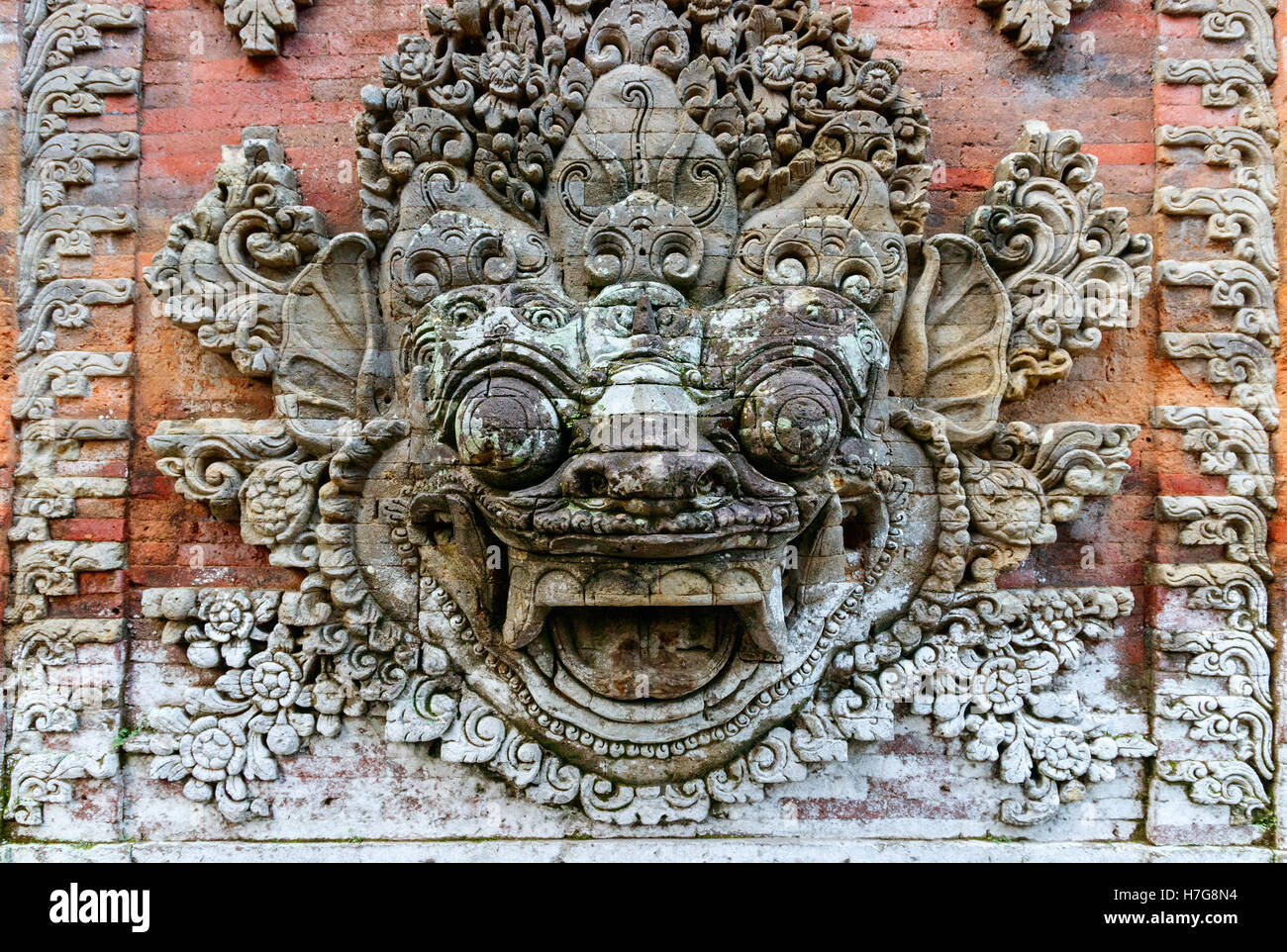 Traditional Indonesian totem of a sacred creature on the wall of the ...