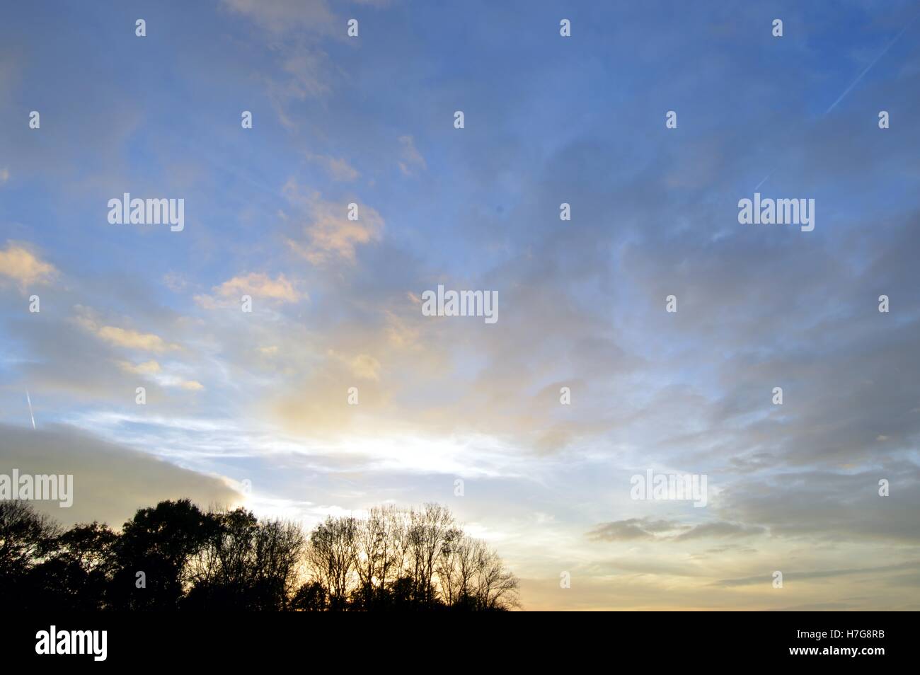 cloudy sky with the colors of the setting sun Stock Photo - Alamy