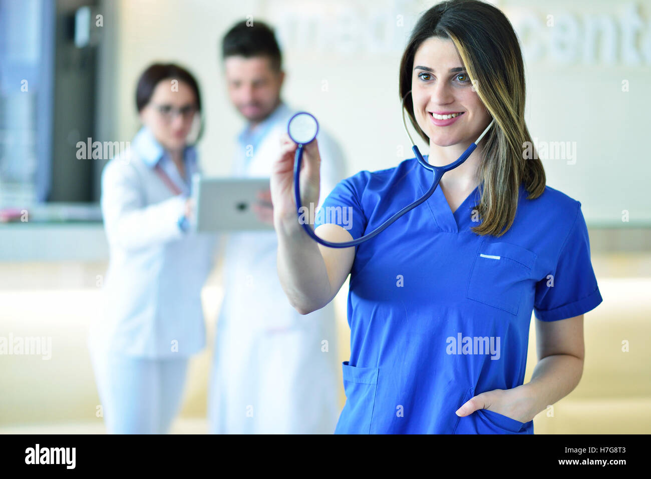 Female doctor leading a medical team at the hospital Stock Photo - Alamy