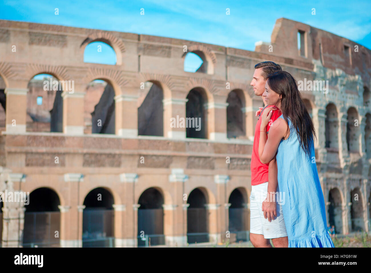 Happy family in Europe. Romantic couple in Rome over Coliseum ...