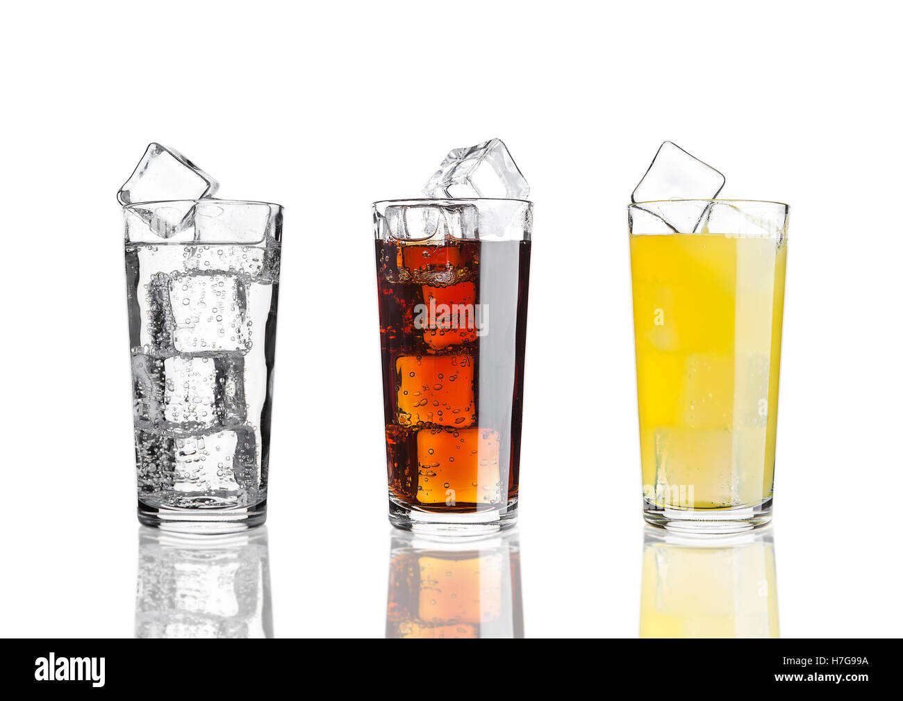 Glasses of cola orange soda lemonade with ice on white background with ...