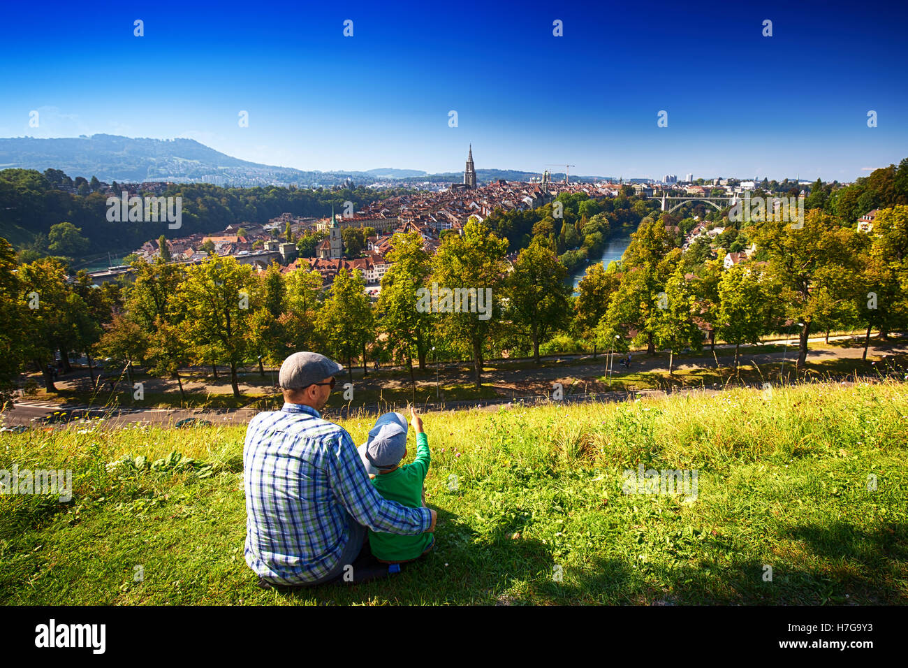 Father and his little son enjoying the view of Bern old city. Bern is ...