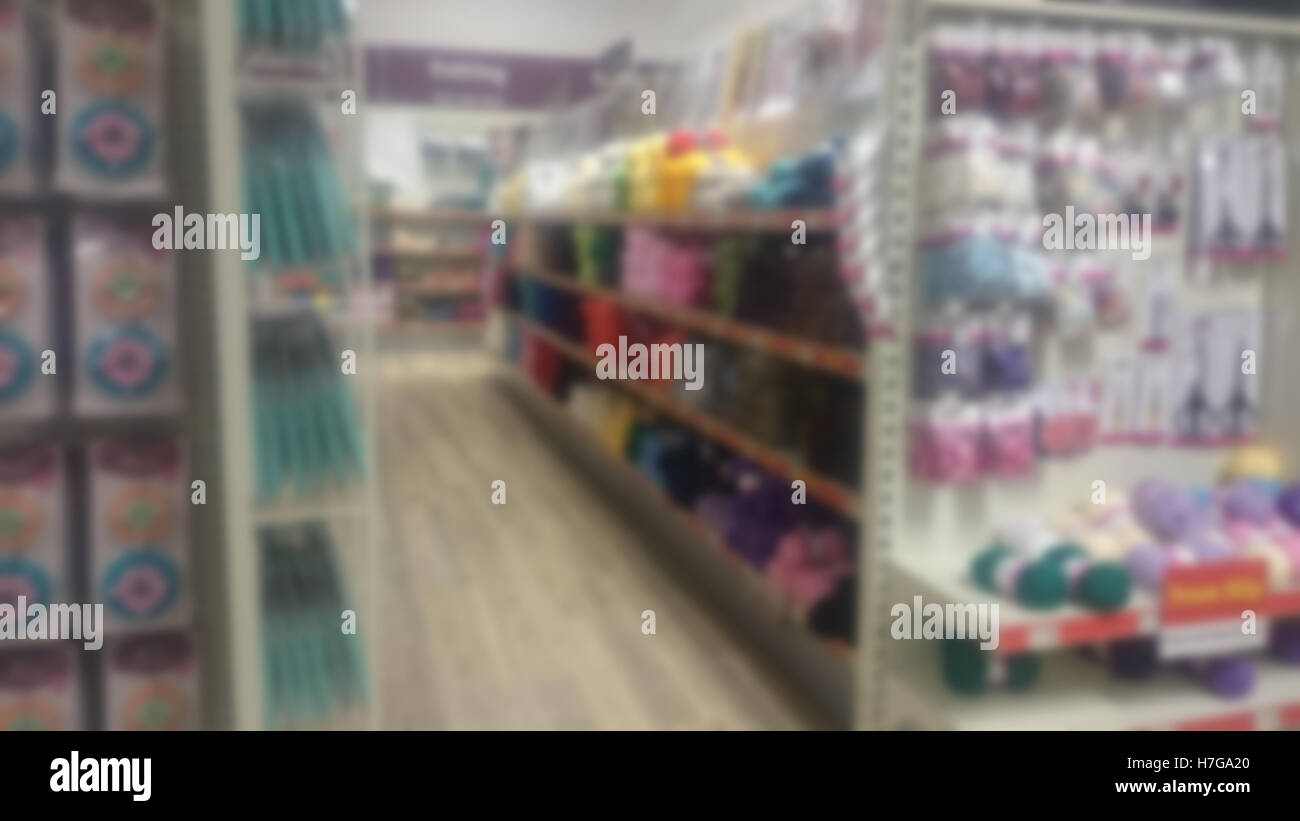 Stacked shelves inside a craft shop. Out of focus Stock Photo - Alamy