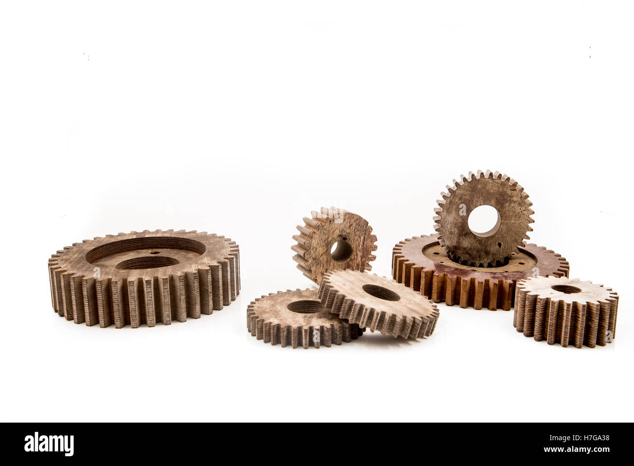 wood gears on plain background Stock Photo - Alamy