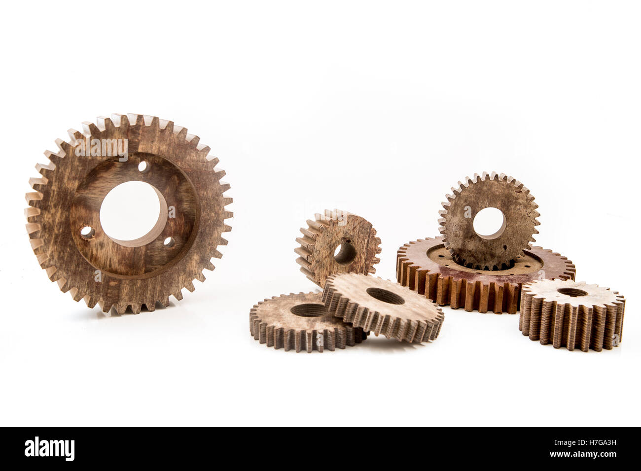 wood gears on plain background Stock Photo - Alamy