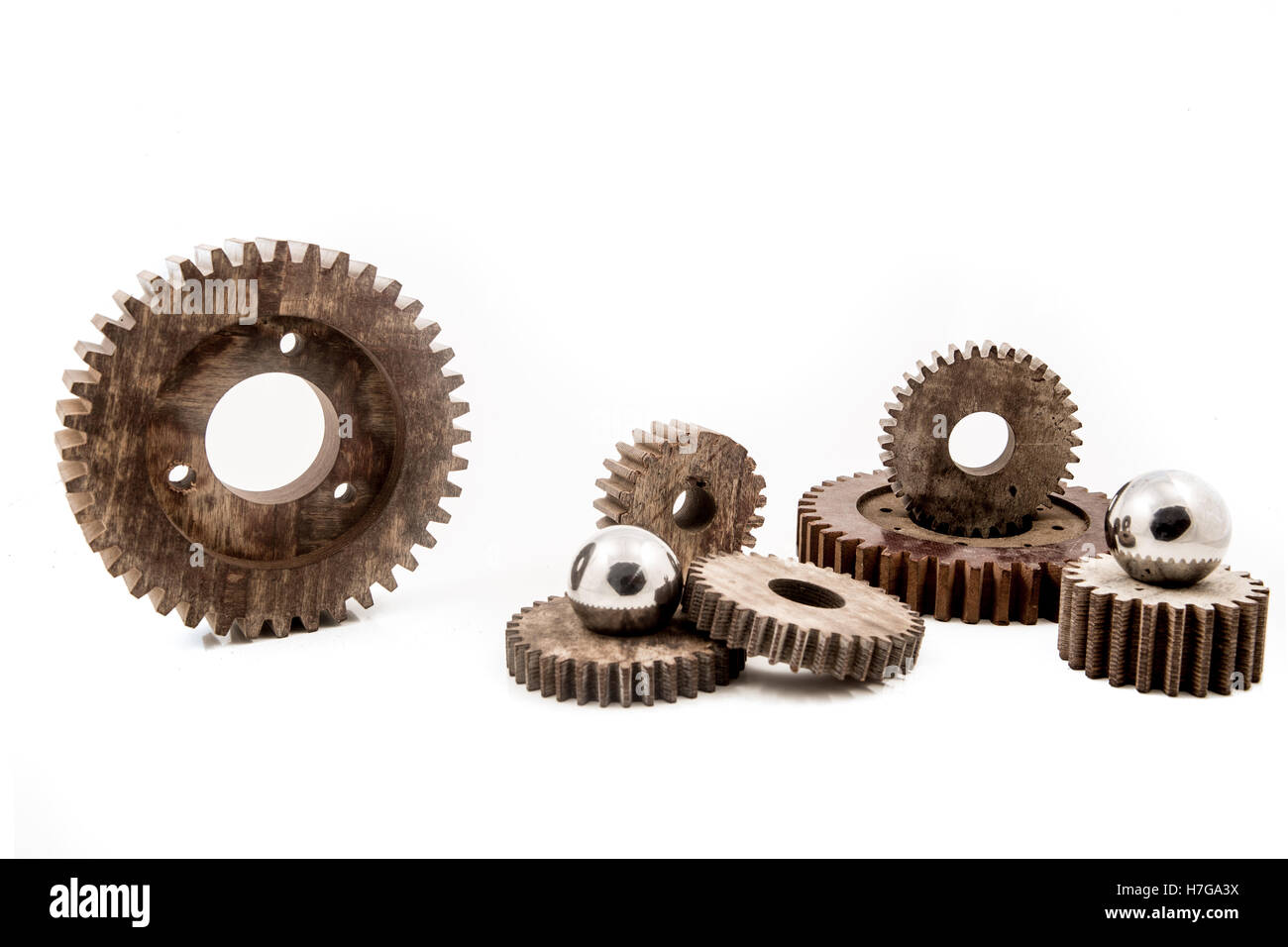 wood gears on plain background Stock Photo - Alamy