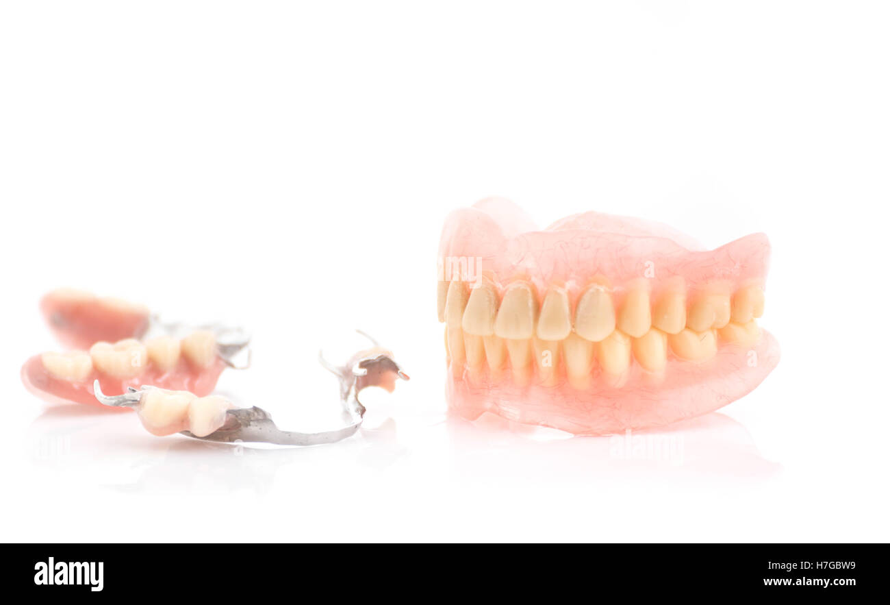 Dirty dentures,Tartar on full dentures and partial dentures on white ...