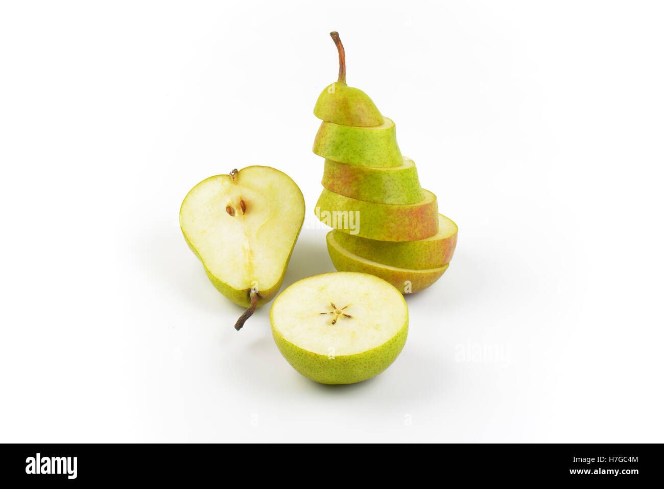 halved and sliced ripe pears on white background Stock Photo - Alamy