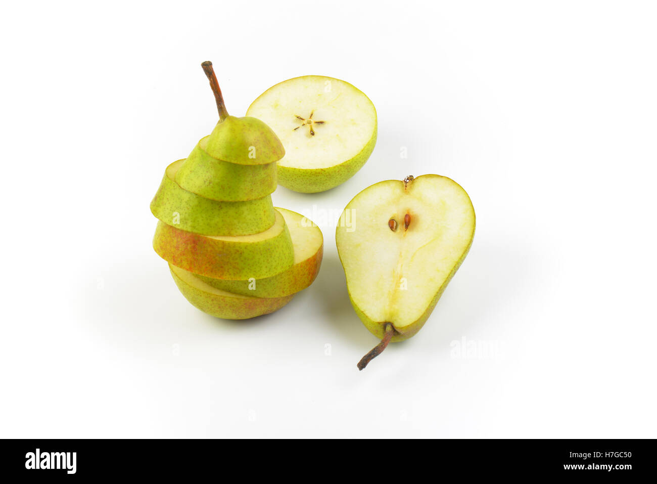 halved and sliced ripe pears on white background Stock Photo - Alamy