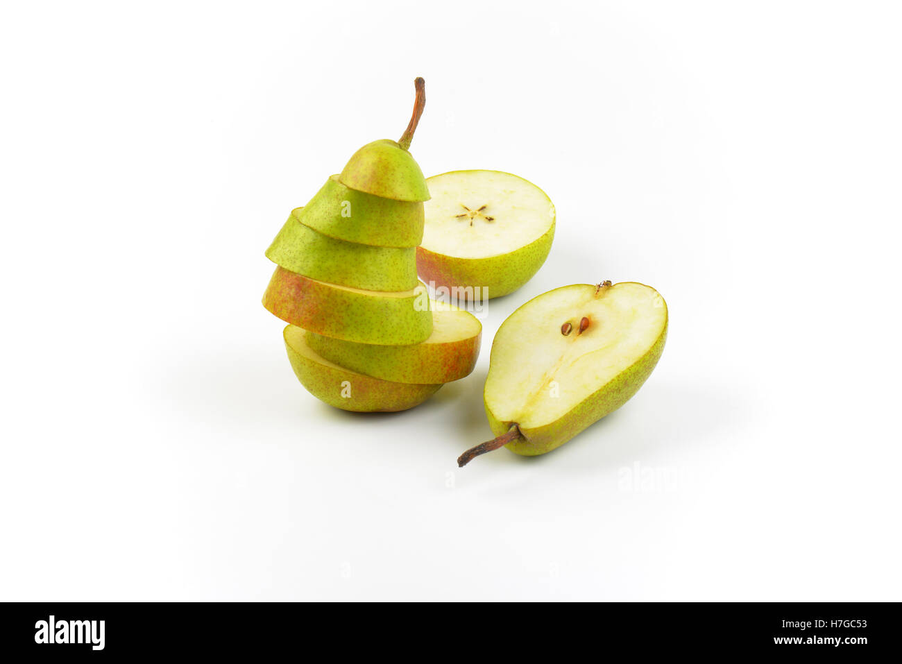 halved and sliced ripe pears on white background Stock Photo - Alamy