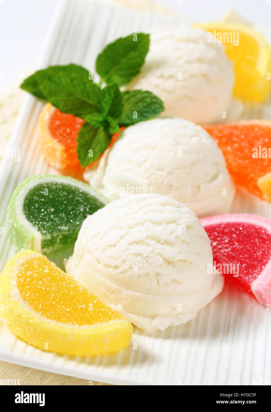 Scoops of white ice cream garnished with jelly candy Stock Photo - Alamy