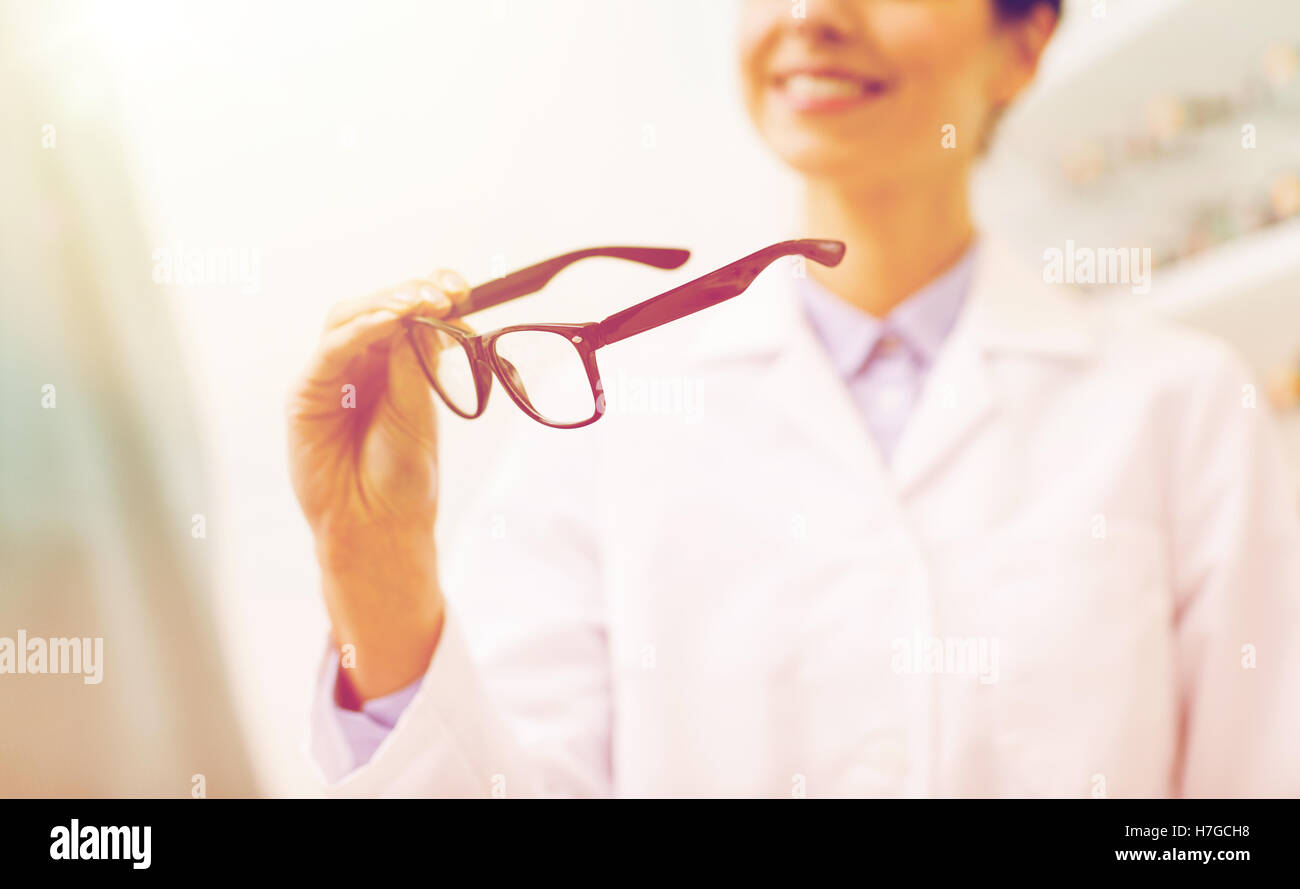 close up of optician with glasses at optics store Stock Photo - Alamy