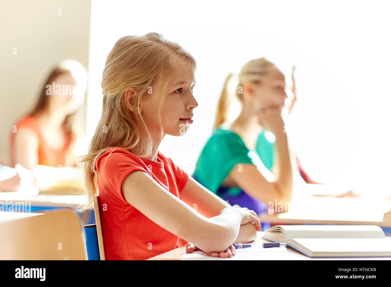 group of students with notebooks at school lesson Stock Photo - Alamy