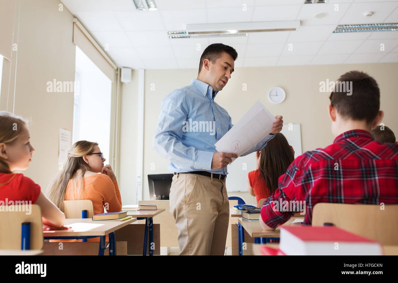group of students and teacher with test results Stock Photo - Alamy