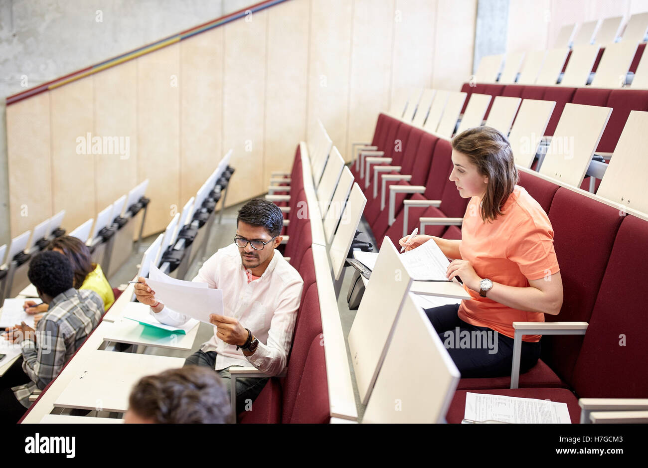 group of students with tests at lecture hall Stock Photo - Alamy