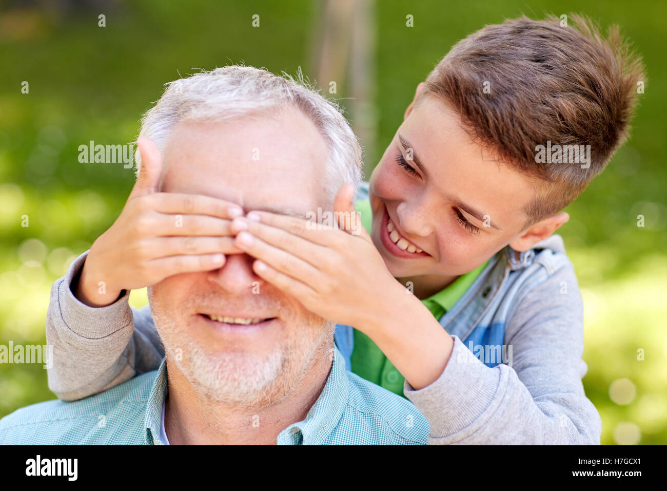 grandfather and grandson playing at summer park Stock Photo - Alamy