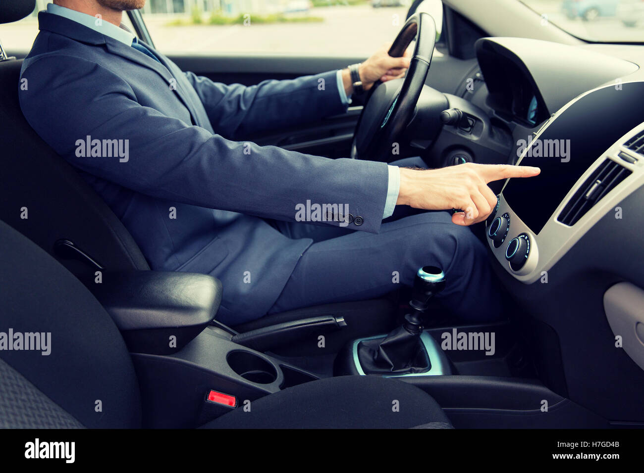 close up of young man in suit driving car Stock Photo - Alamy