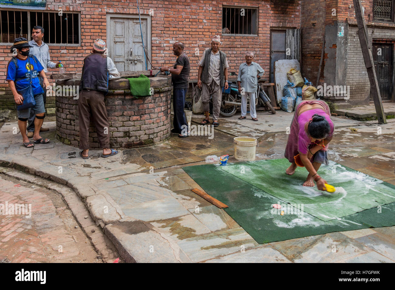 Nepal kathmandu woman washing clothes hi-res stock photography and ...