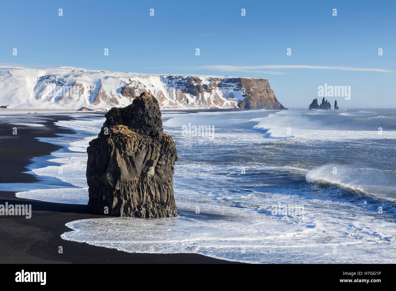 Arnardrangur / Eagle rock, basalt sea stack on the Black sand beach ...