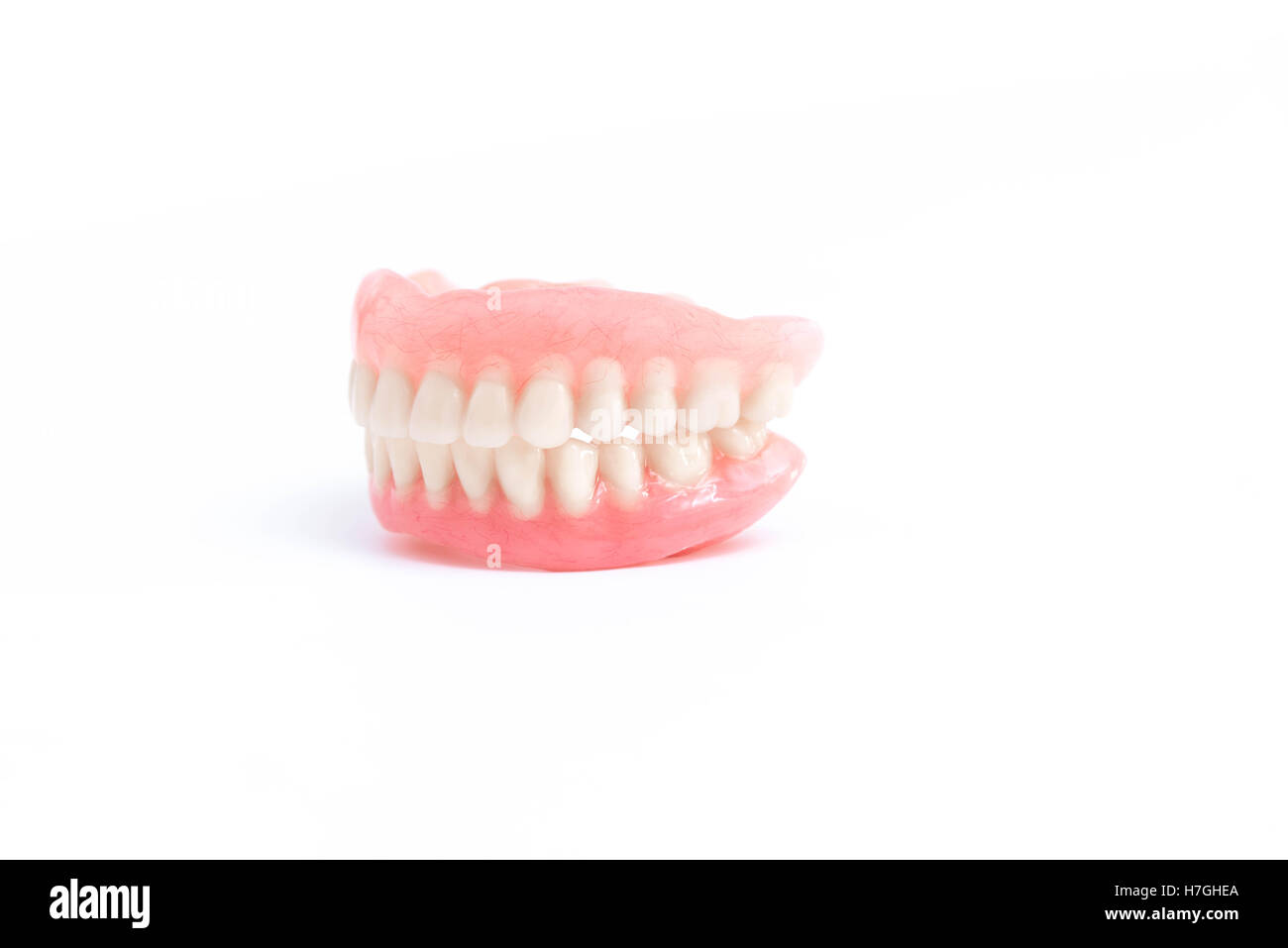 Full dentures on white background Stock Photo - Alamy