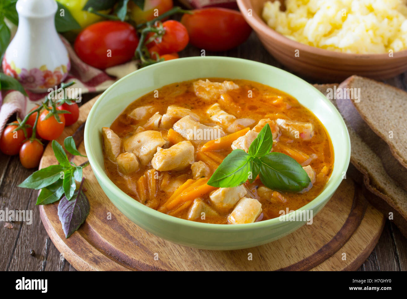 Traditional hot stew with meat on the aged wooden background. Healthy ...