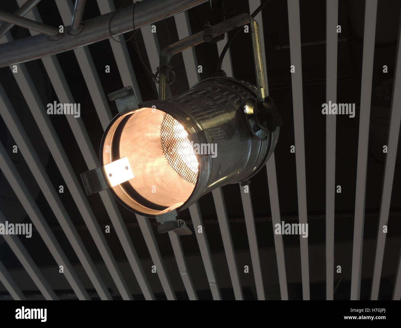 Studio light ready for action hanging on boom Stock Photo - Alamy