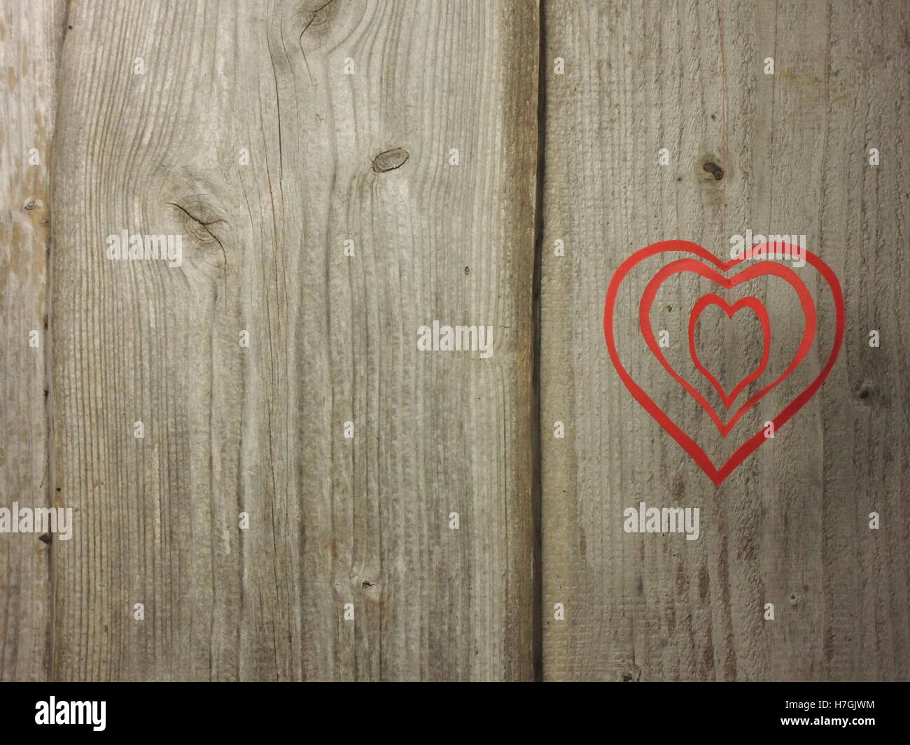 Valentine card - hearts on rough wooden background Stock Photo - Alamy