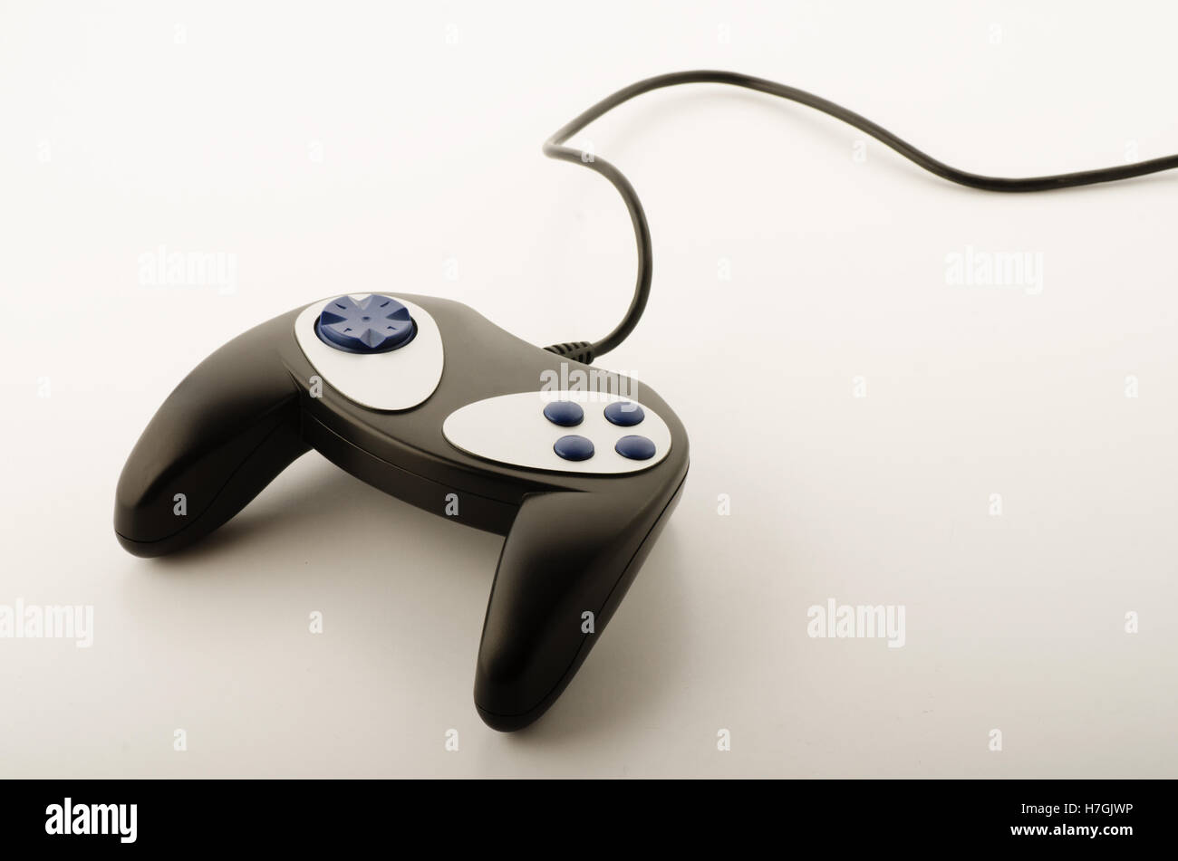 Black game controller isolated on a white background Stock Photo - Alamy