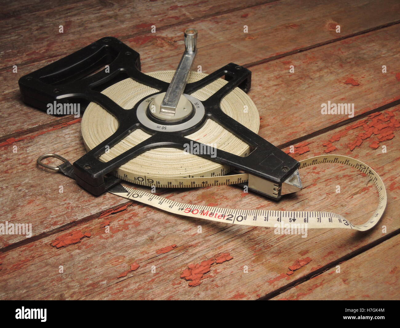 50m measuring tape on rough table Stock Photo - Alamy