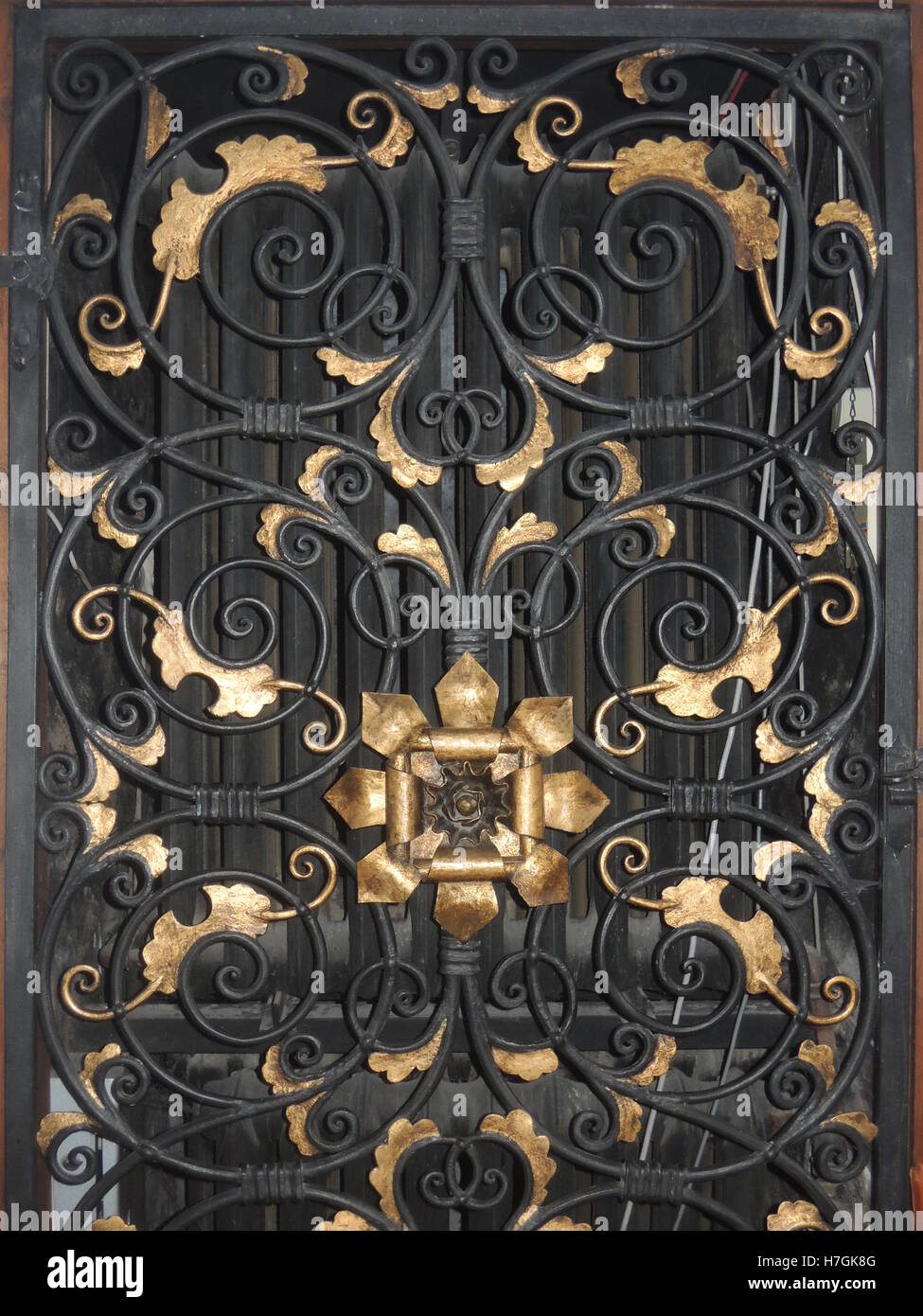 Old golden iron gate with ornaments Stock Photo - Alamy