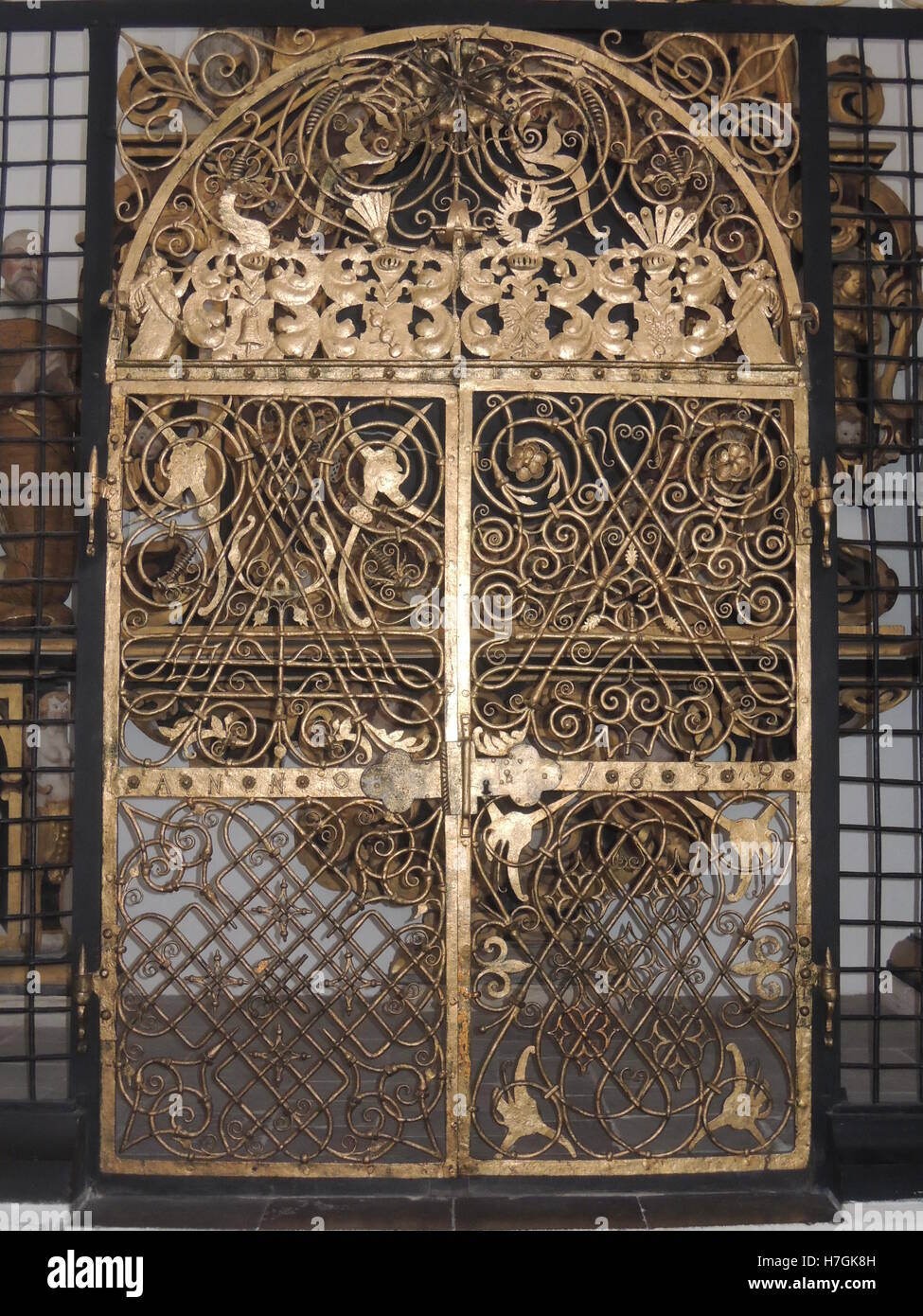 Old golden iron gate with ornaments Stock Photo - Alamy