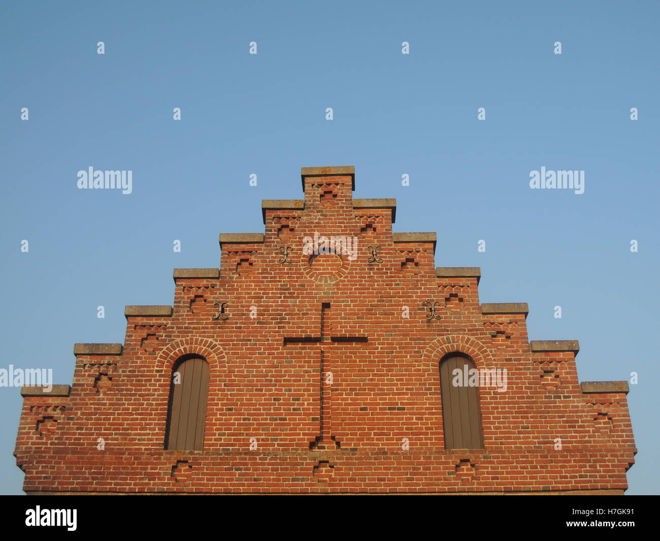 Staircase to heaven - gable of old Danish rural church with cross Stock ...