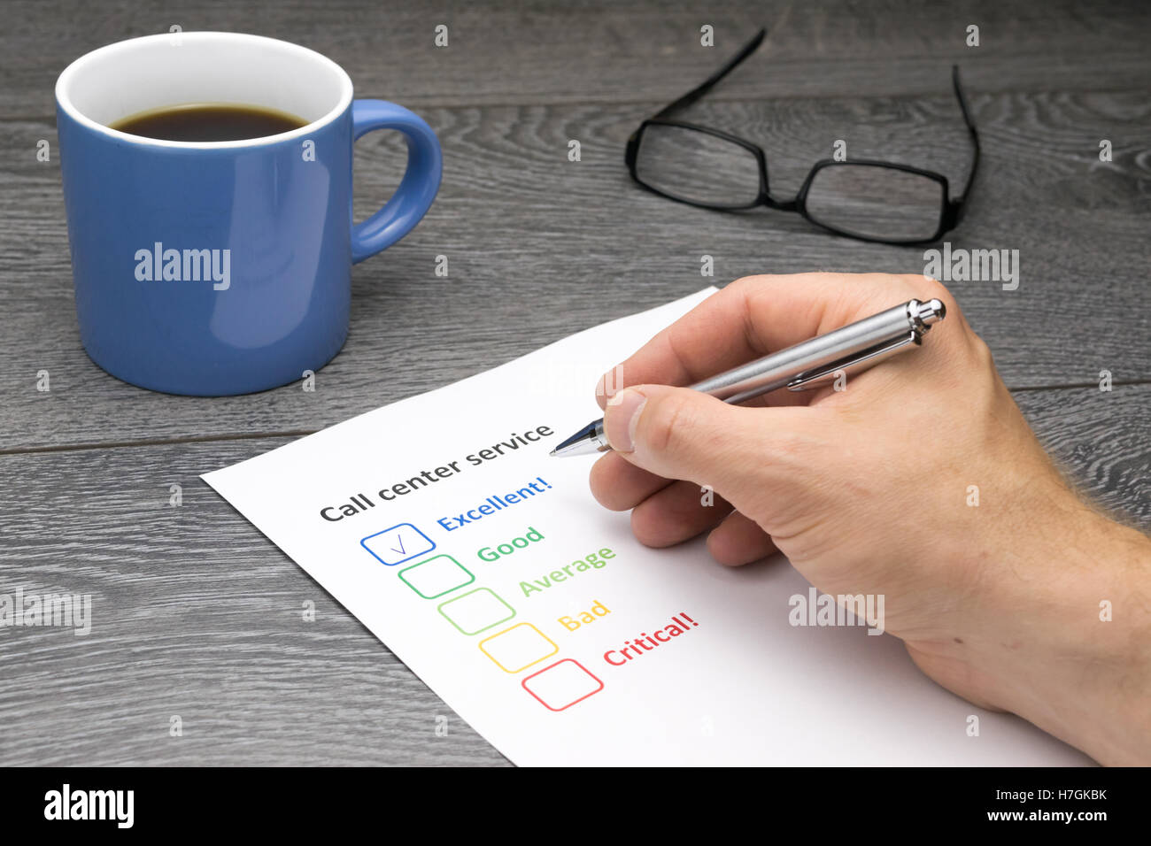 Call center offering excellent service. Customer filling out survey ...