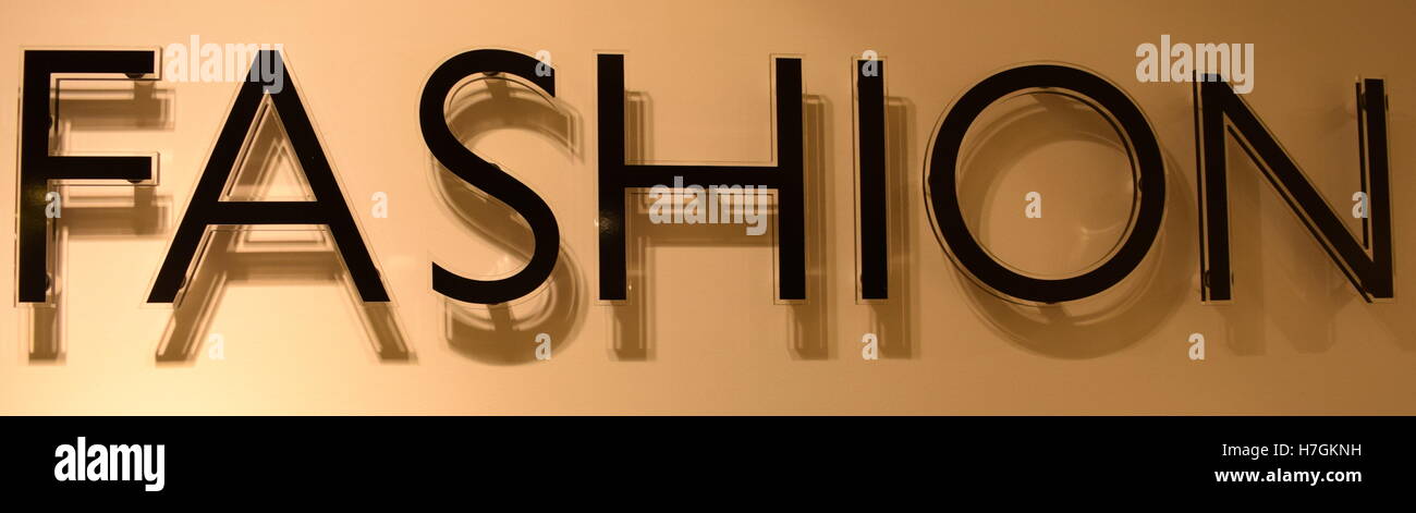 Black text Fashion casting shadow on gloden background. Could be used ...