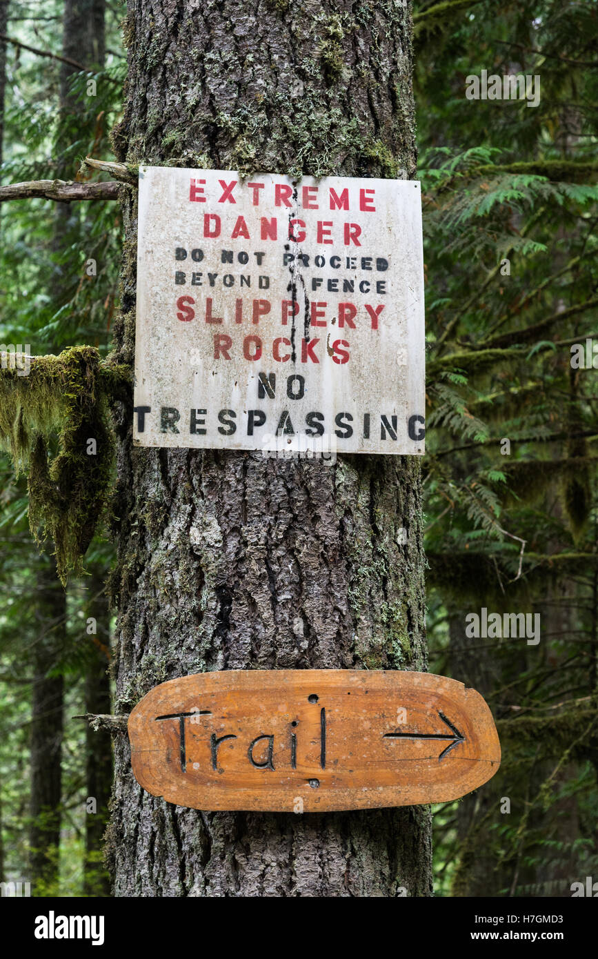 Warning signs posted on a tree trunk at Mt Baker Wildness area in the ...