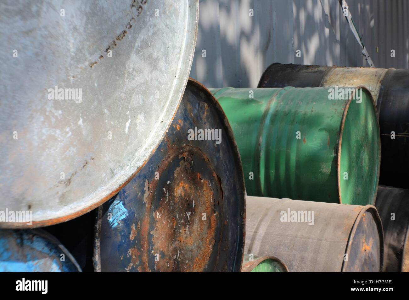 Metal oil barrels in a stack Stock Photo - Alamy