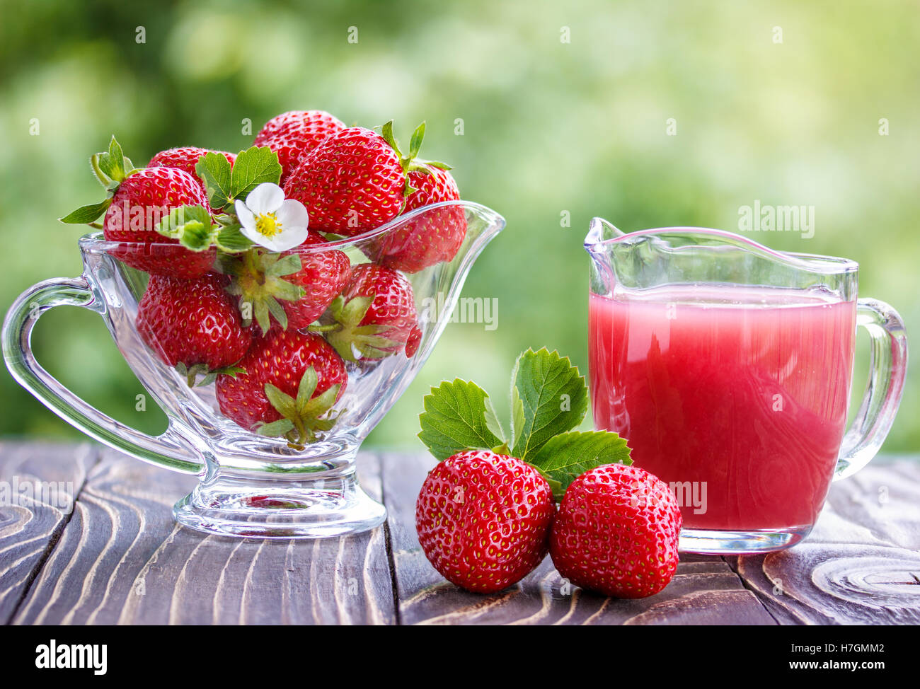 strawberry in bowl and juice Stock Photo - Alamy