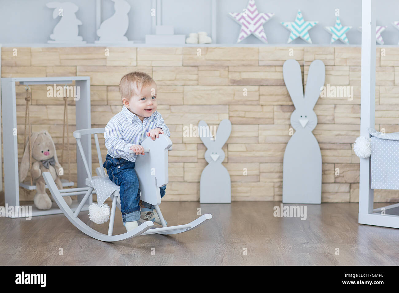 Child swinging on chair hi-res stock photography and images - Alamy