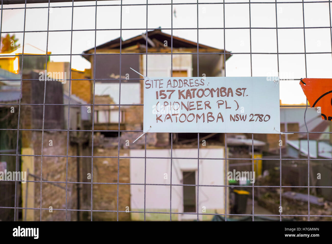 Renovation site behind a wire mesh with a blank sign at sunset Stock ...