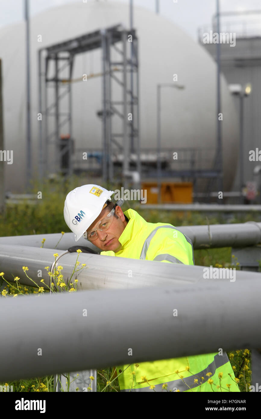 scientist examining pipes at waste water treatment plant Stock Photo ...